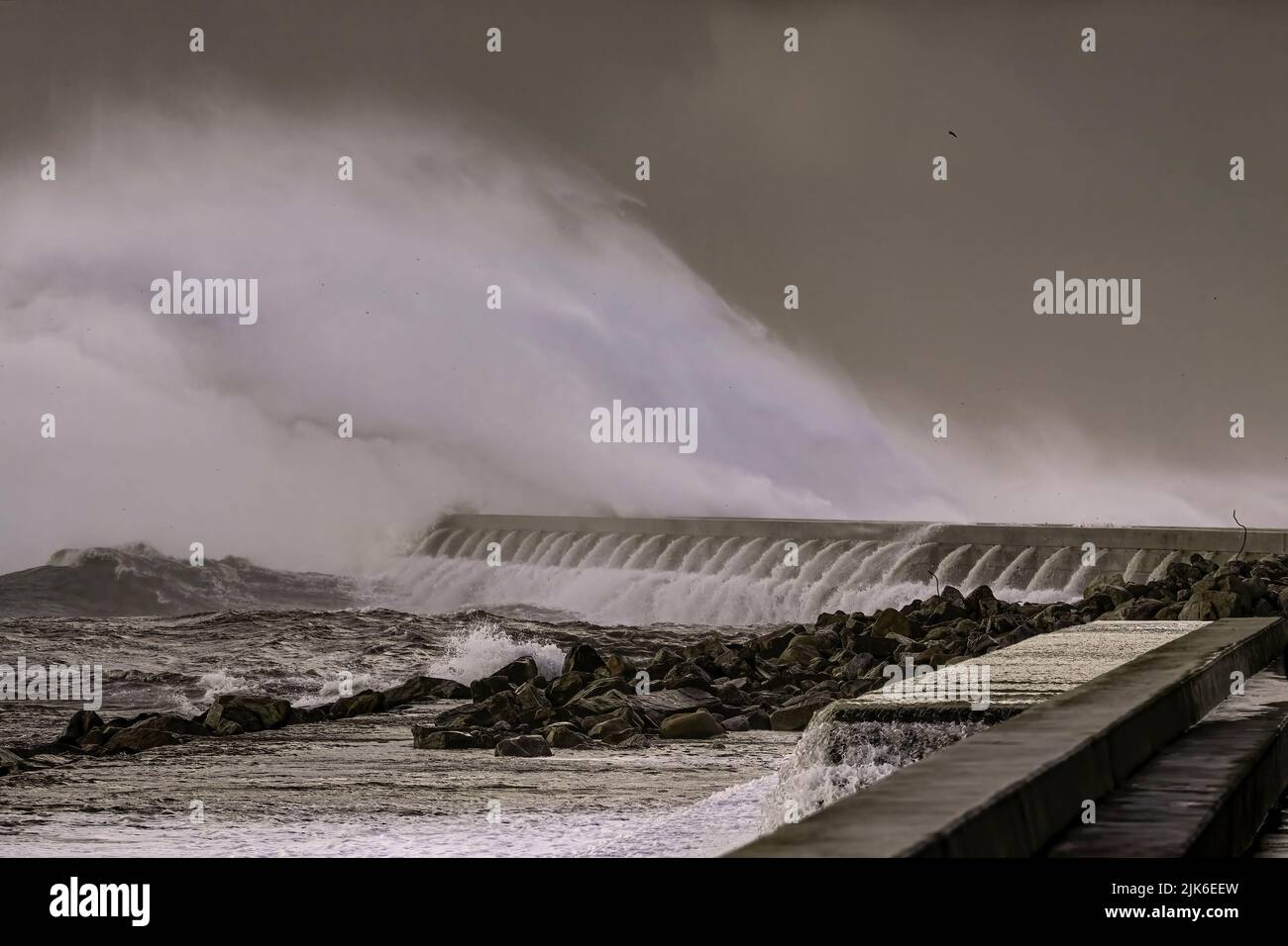 Stormy sea wave splash with heavy wind spray. Douro river mouth, Porto ...