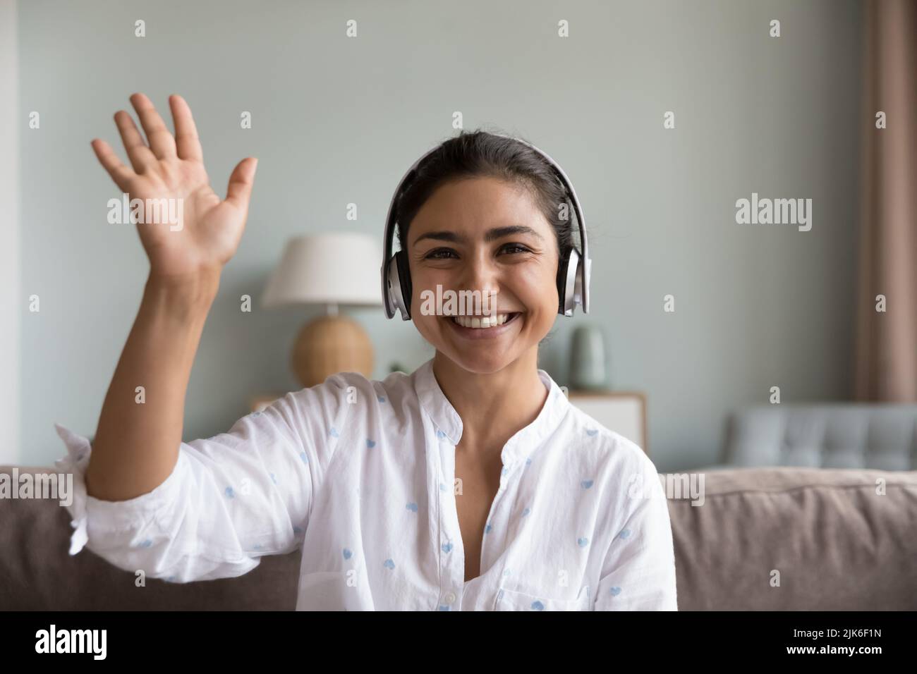 Happy beautiful Indian woman in wireless head phones video call Stock ...