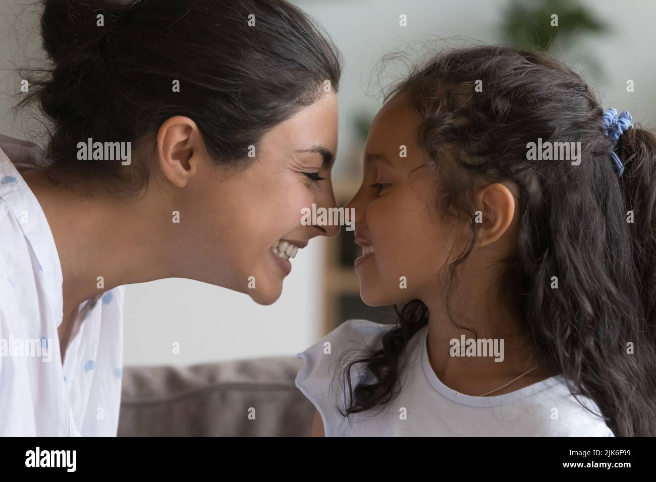 Happy loving Indian mom and daughter kid hugging with affection Stock ...