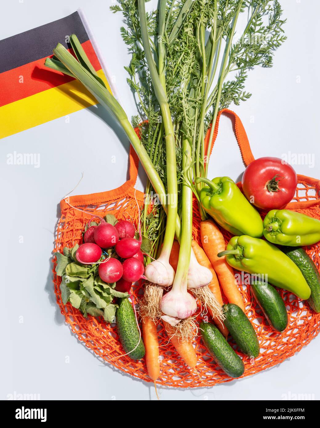 Natural, farm vegetables on a cotton bag with Germany flag on a blue ...