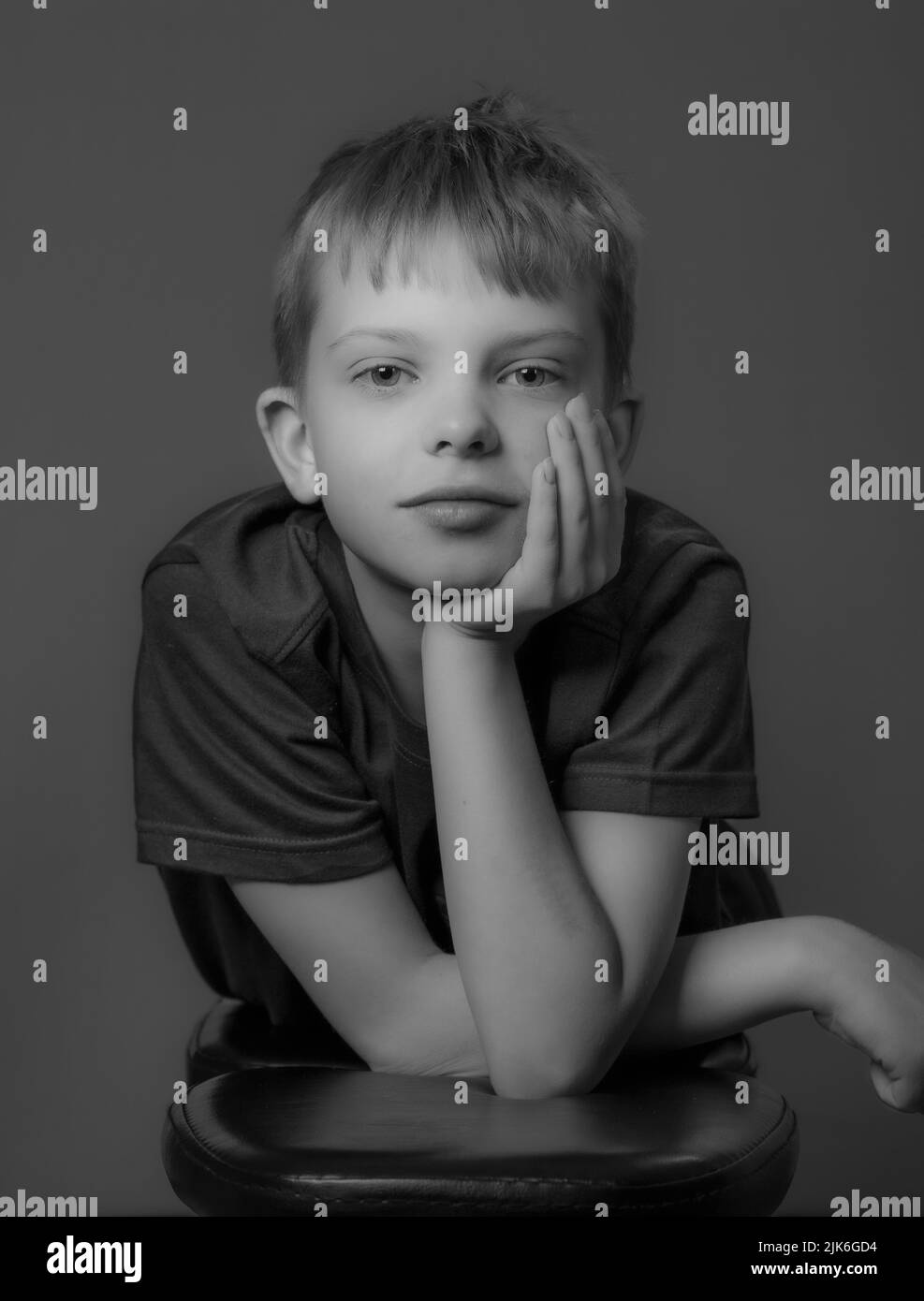 Young boy in studio pose Stock Photo - Alamy