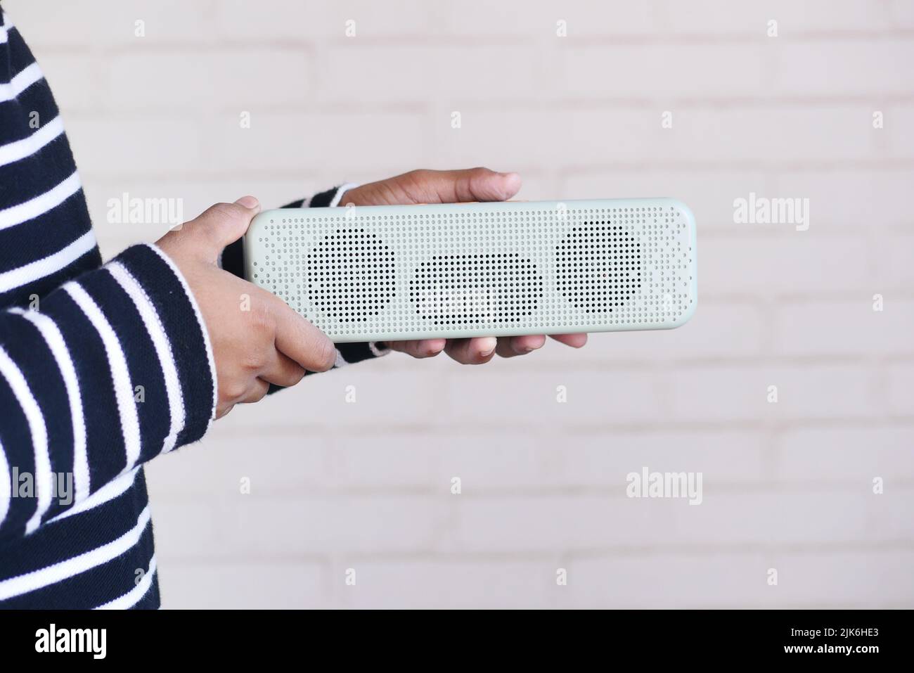 man's hand using smart speaker with copy space Stock Photo - Alamy