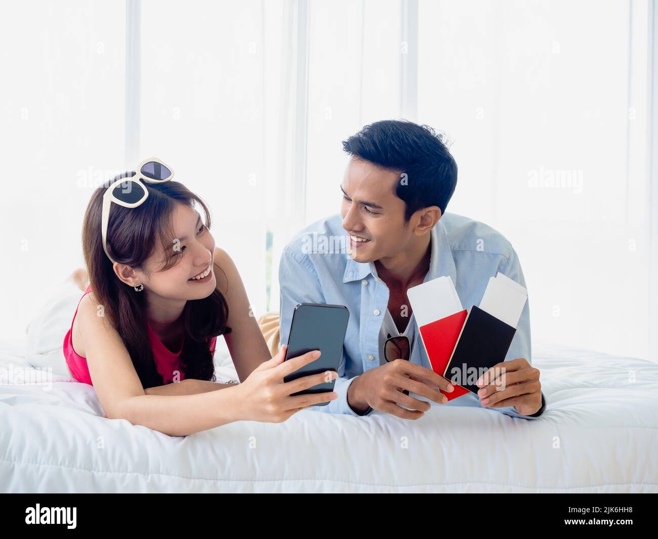 Happy Asian couple with flight booking for summer trip, travel abroad ...