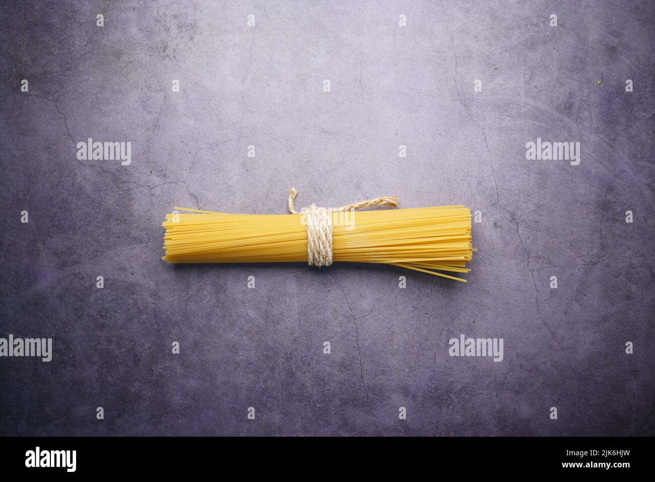 flat congestion of Yellow long spaghetti on black background Stock ...