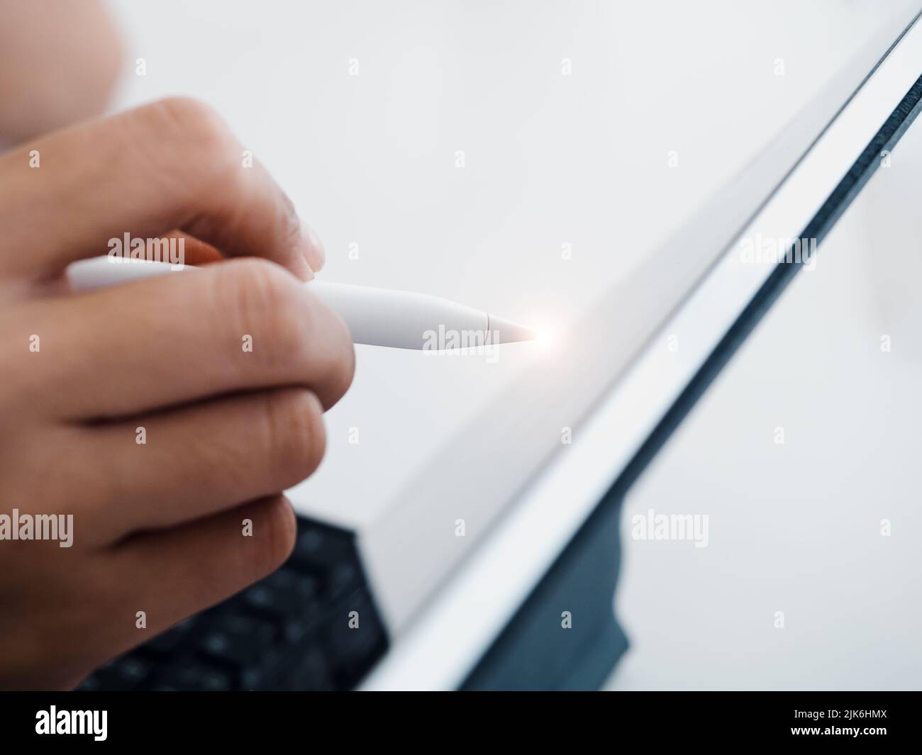 Close up white electronic pen or pencil in hand, write, draw or sign on ...