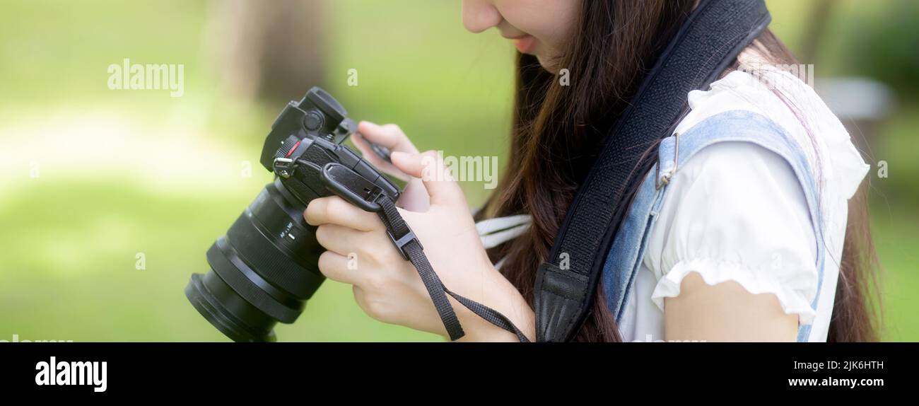 Beautiful happiness young asian woman using camera take a photo for ...