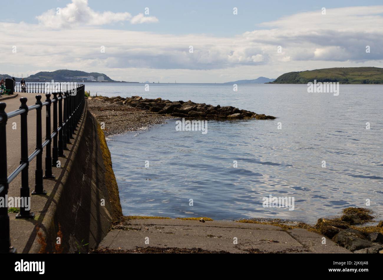 Looking out across the sea to the Islands from a slipway in Largs Stock ...