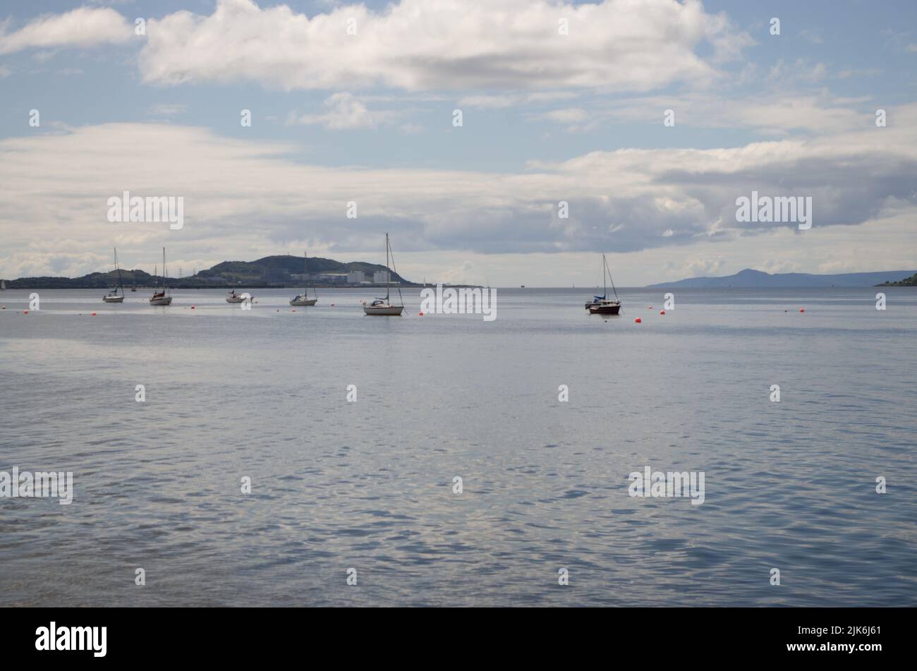 Sailing boats moored off the coast at Largs Stock Photo - Alamy