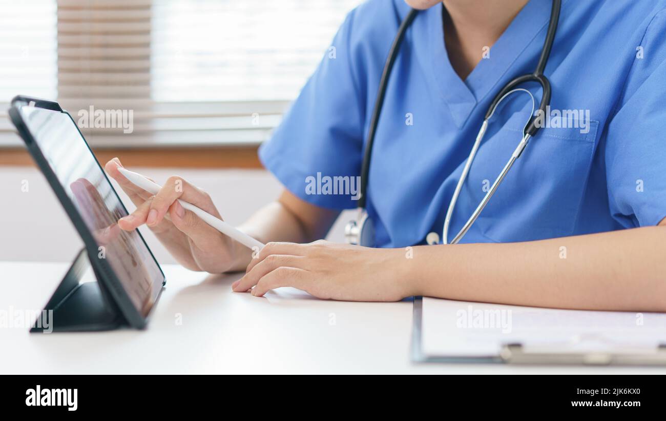 Pet care concept, Female veterinary using tablet for relaxation after ...