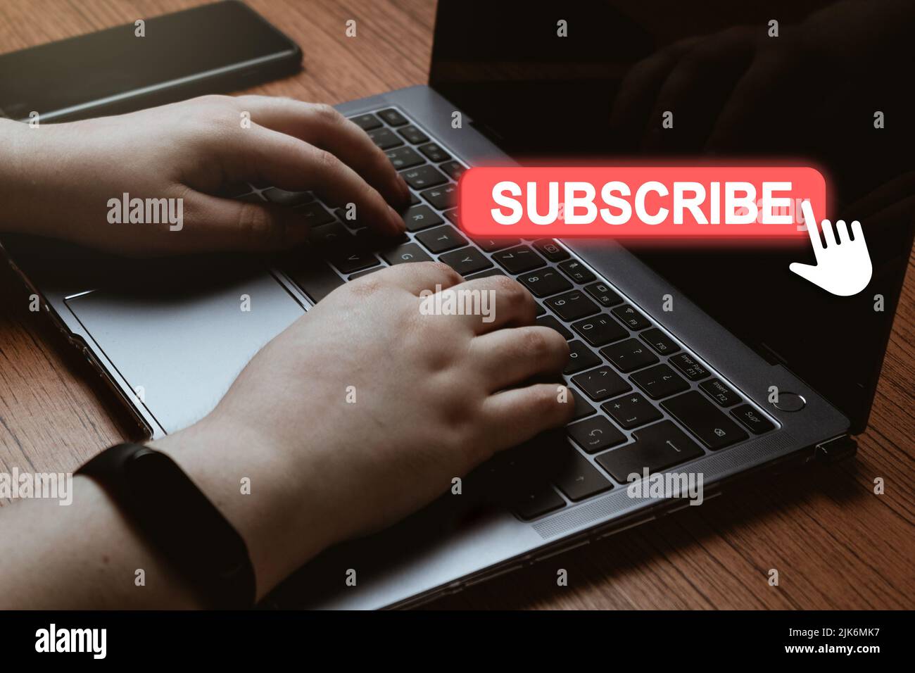 Woman using laptop with subscribe button. Internet of things ...