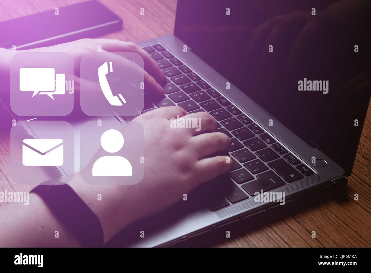 Businesswoman using laptop with hologram icons. Contact us or Customer ...