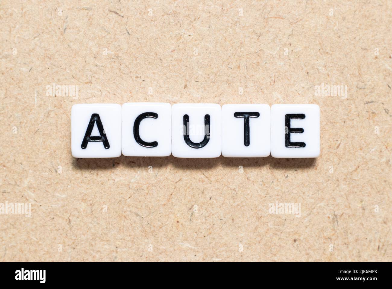 White tile alphabet letter with word acute on wood background Stock ...