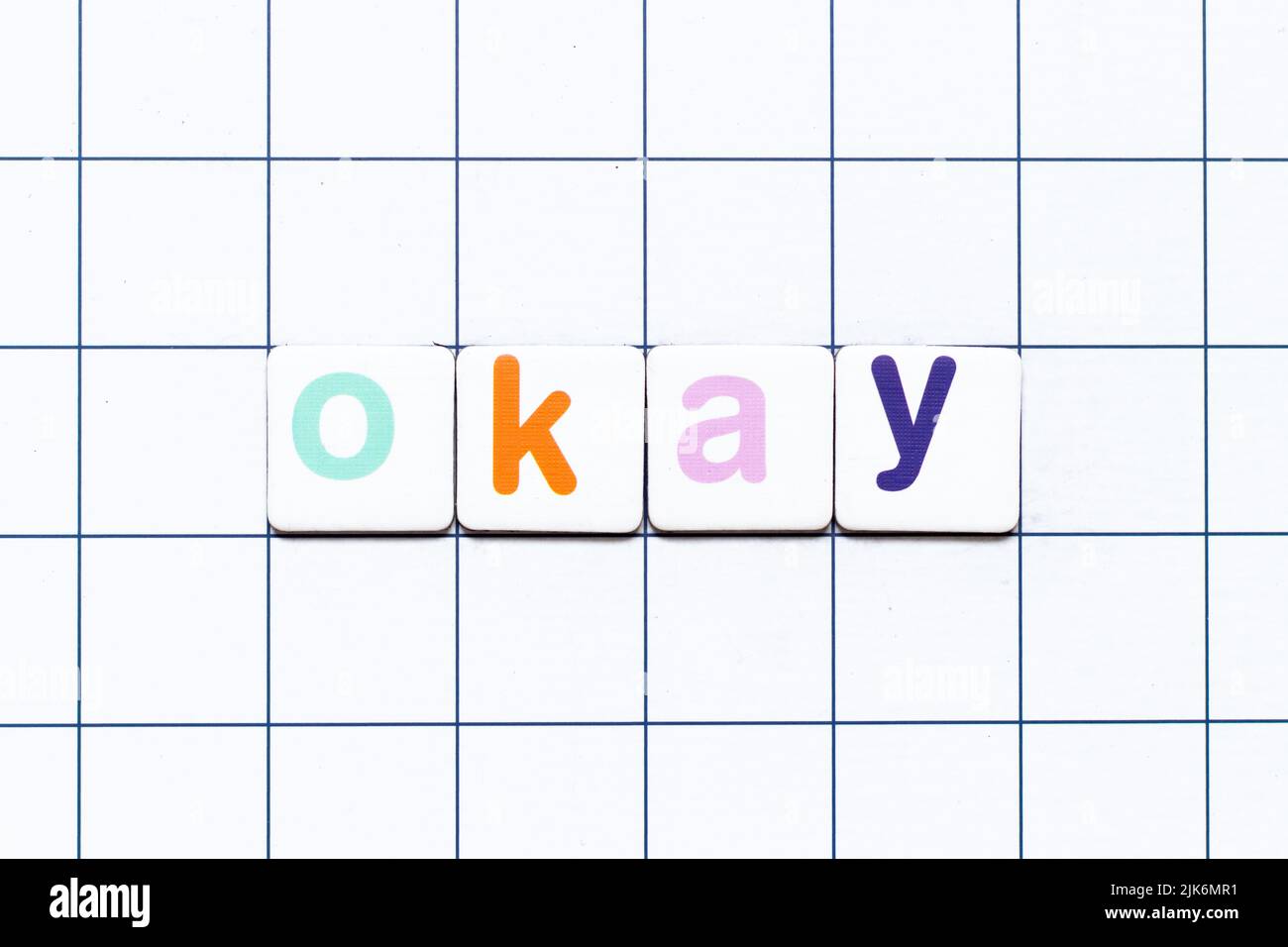 Colorful tile letter in word okay on white grid background Stock Photo ...