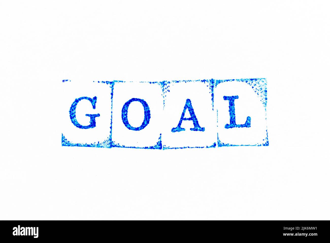 Blue color ink rubber stamp in word goal on white paper background ...