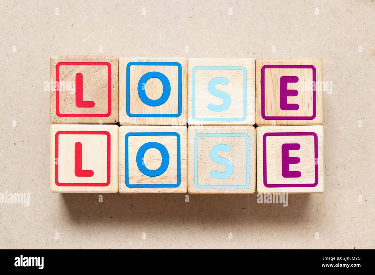 Color letter block in word lose lose on wood background Stock Photo - Alamy
