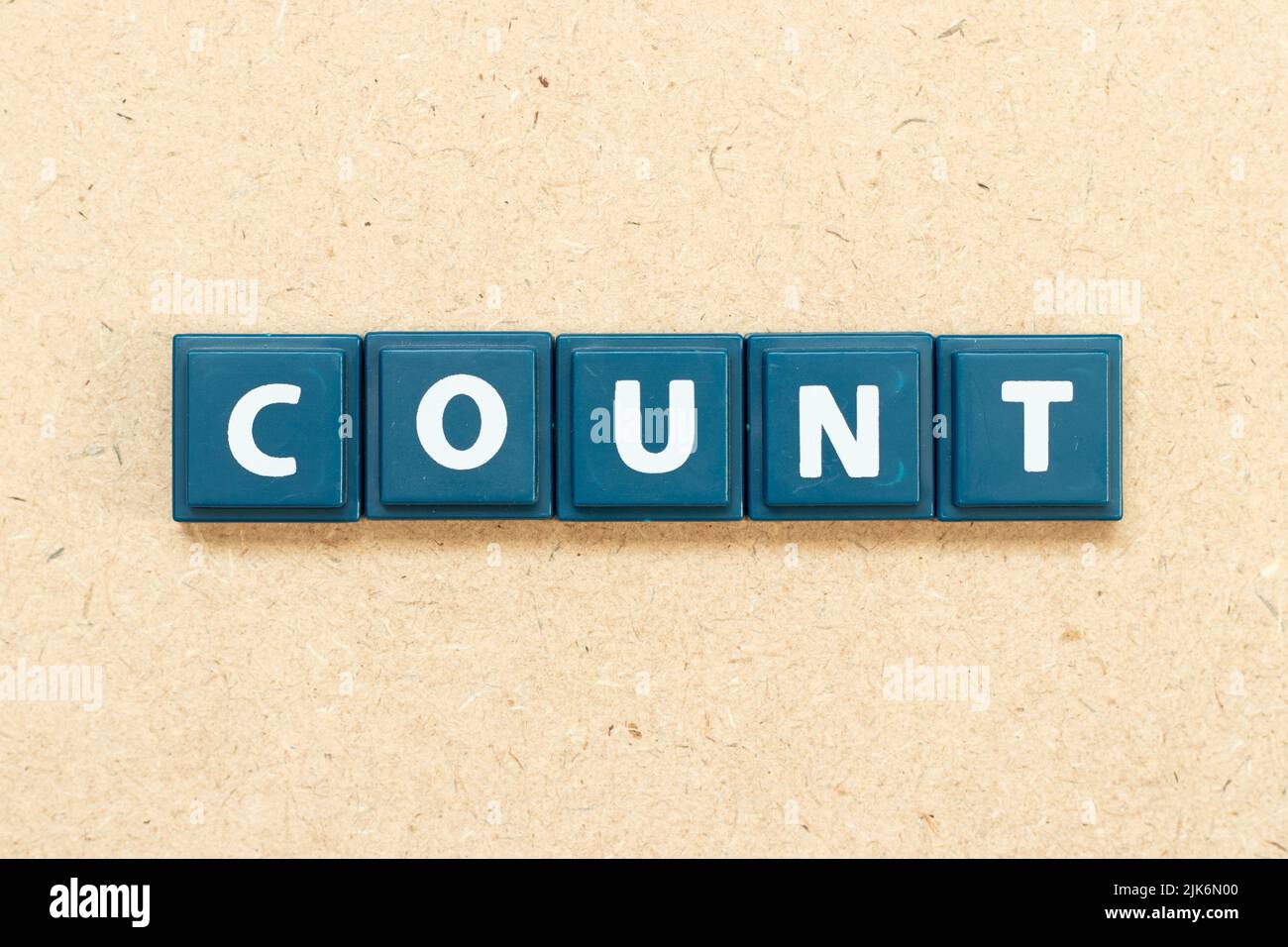 Tile alphabet letter in word count on wood background Stock Photo - Alamy