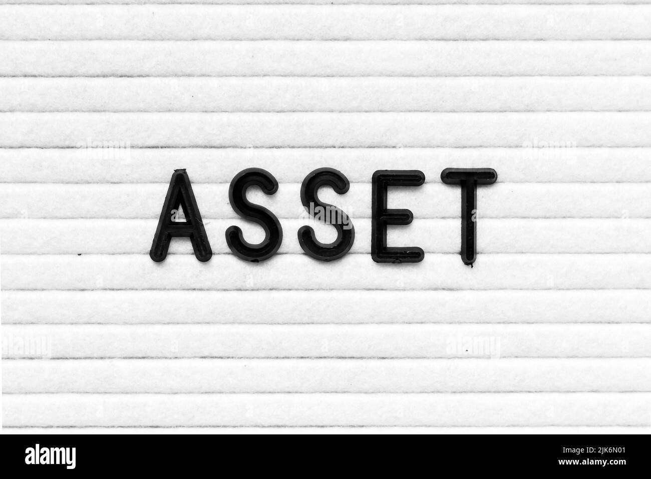 Black color letter in word asset on white felt board background Stock ...