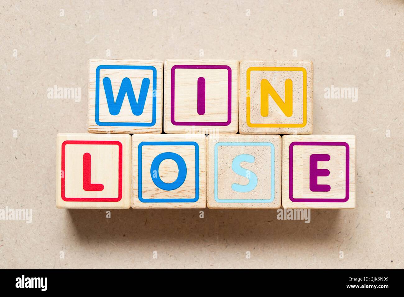 Color letter block in word win lose on wood background Stock Photo - Alamy