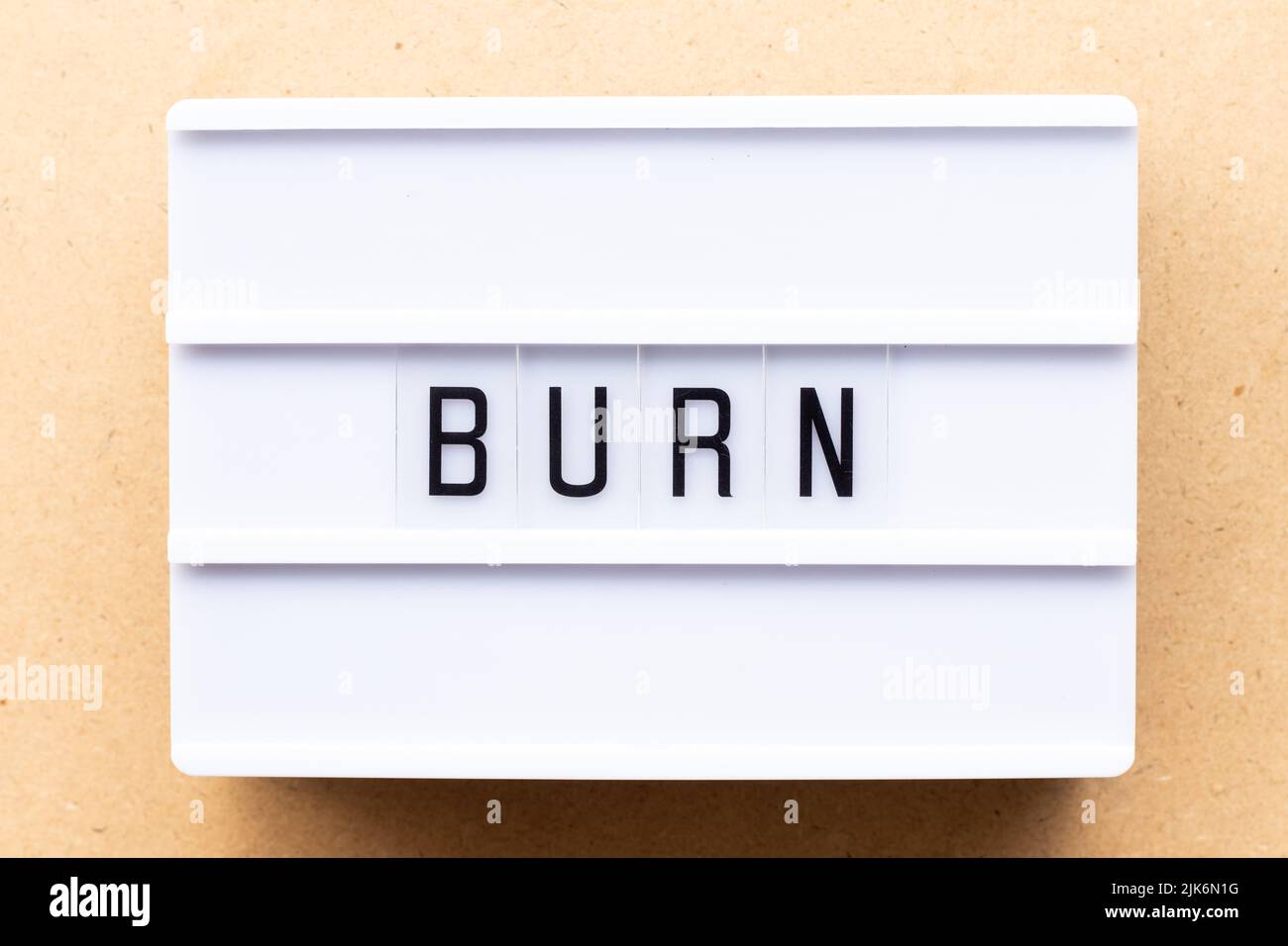 Lightbox with word burn on wood background Stock Photo - Alamy