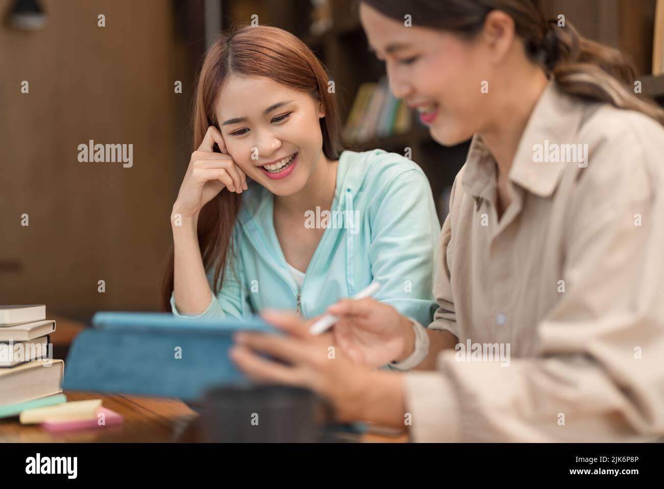 Education concept, Female tutor pointing math quiz on tablet and ...