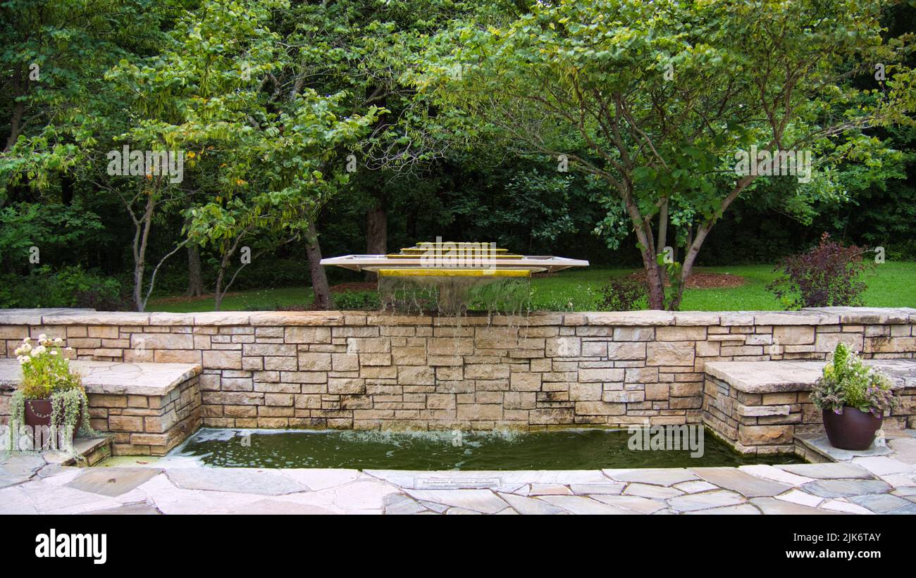 Water flowing from this fountain outside of a rural chapel in ...