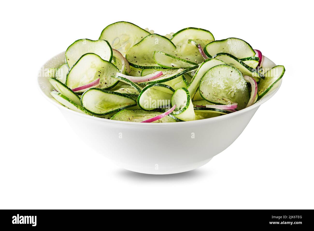 Cucumber salad bowl isolated on white background Stock Photo - Alamy