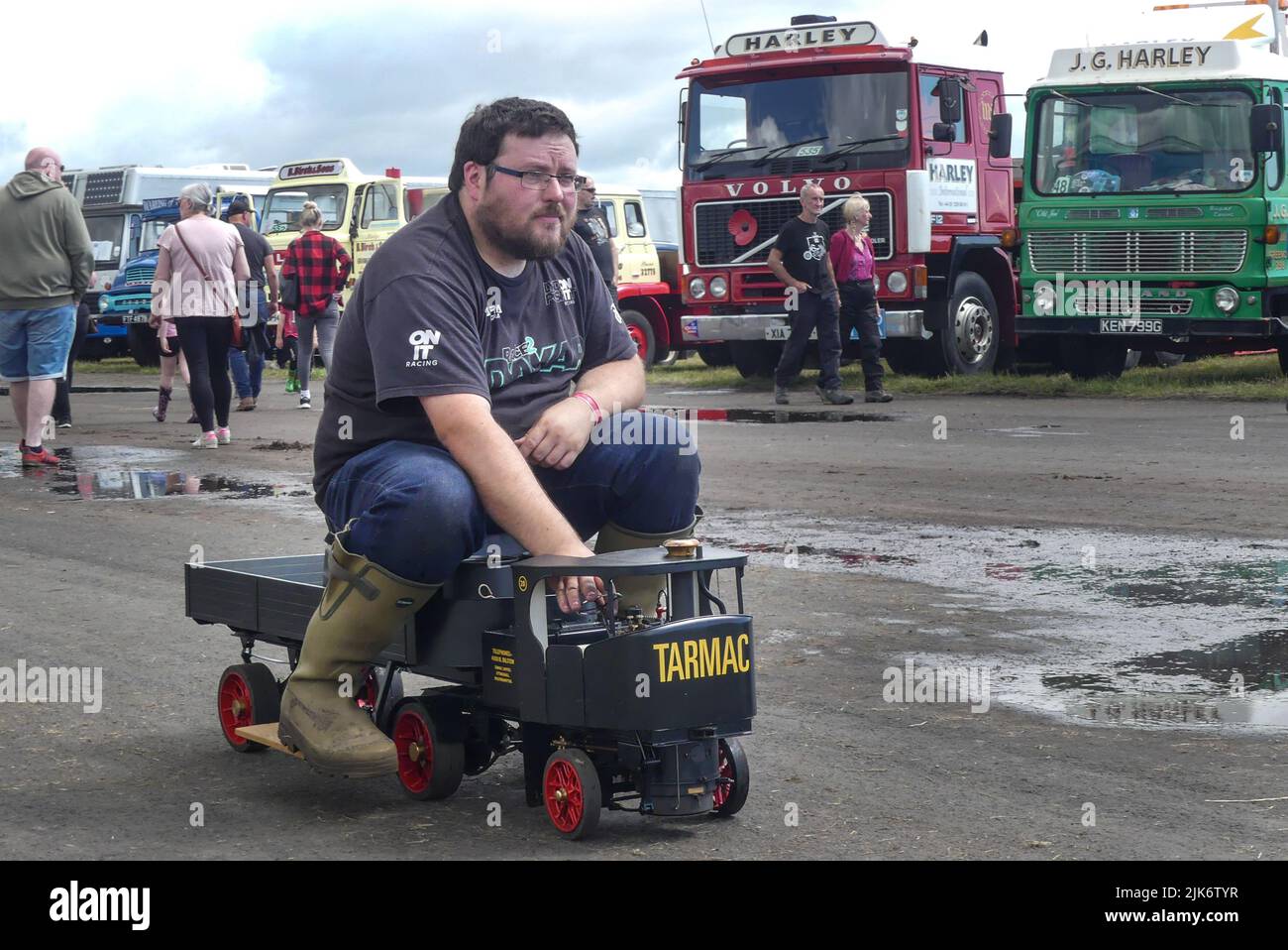 Flookburgh, Cumbria, UK. July 31st 2022. A man rides a mini Tarmac ...