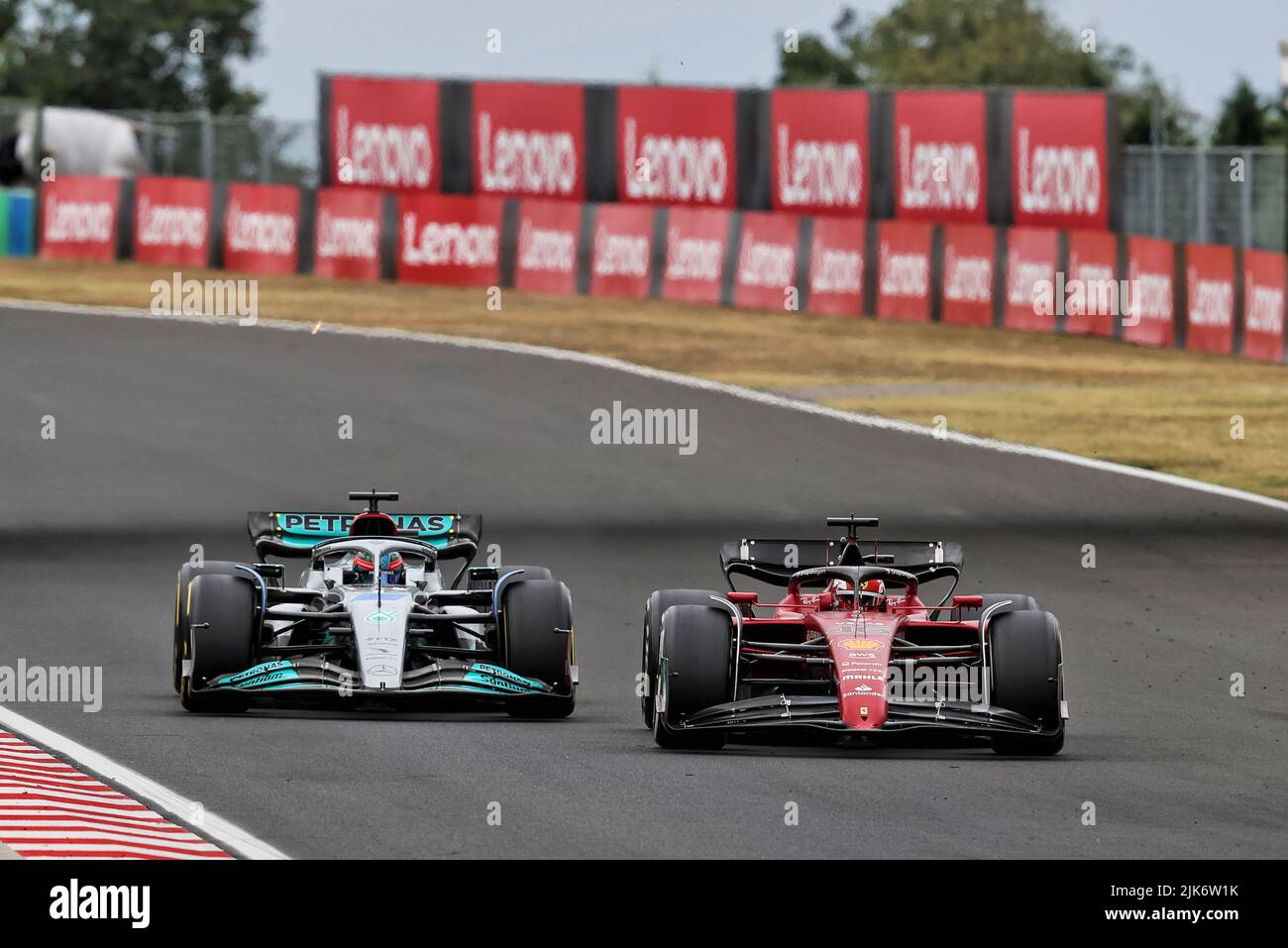 George Russell (GBR) Mercedes AMG F1 W13 and Charles Leclerc (MON ...