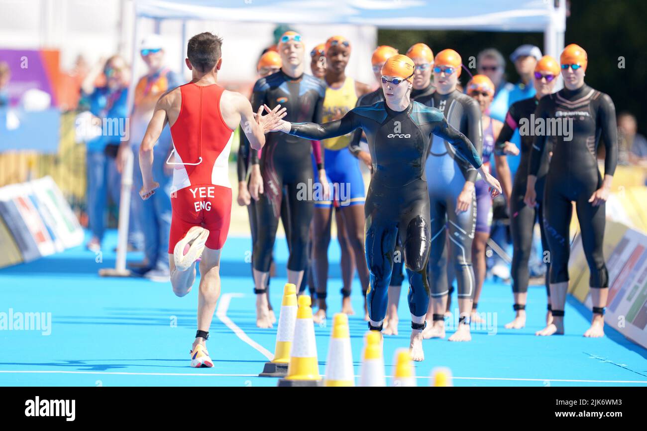 England's Alex Yee hands over to Sophie Coldwell on their way to gold ...
