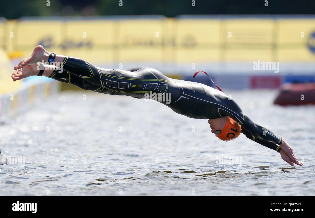 England's Sam Dickinson starts his swim on their way to gold in the ...
