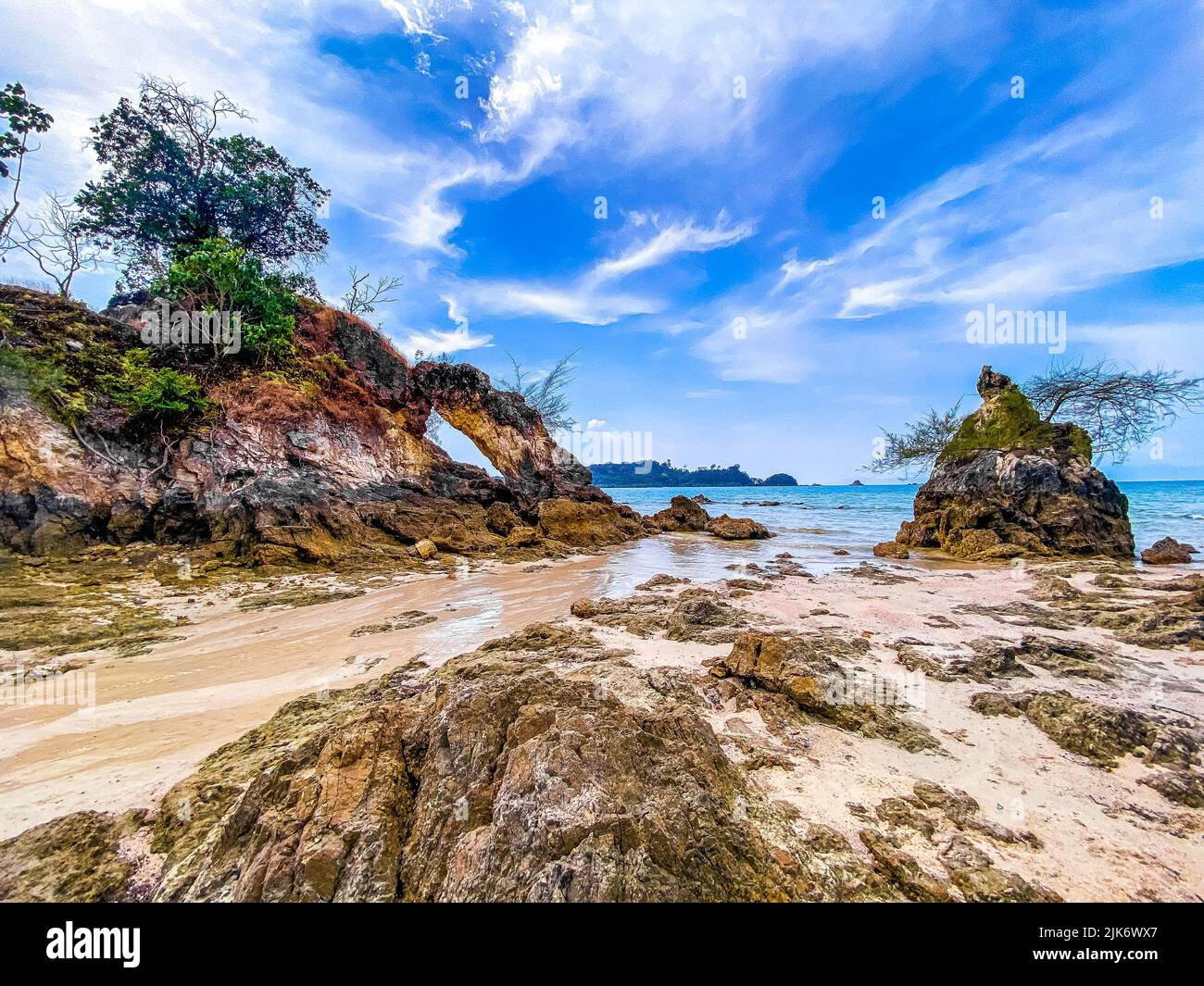 Koh Phayam beach Hin Talu with rock arch formation in Ranong, Thailand ...