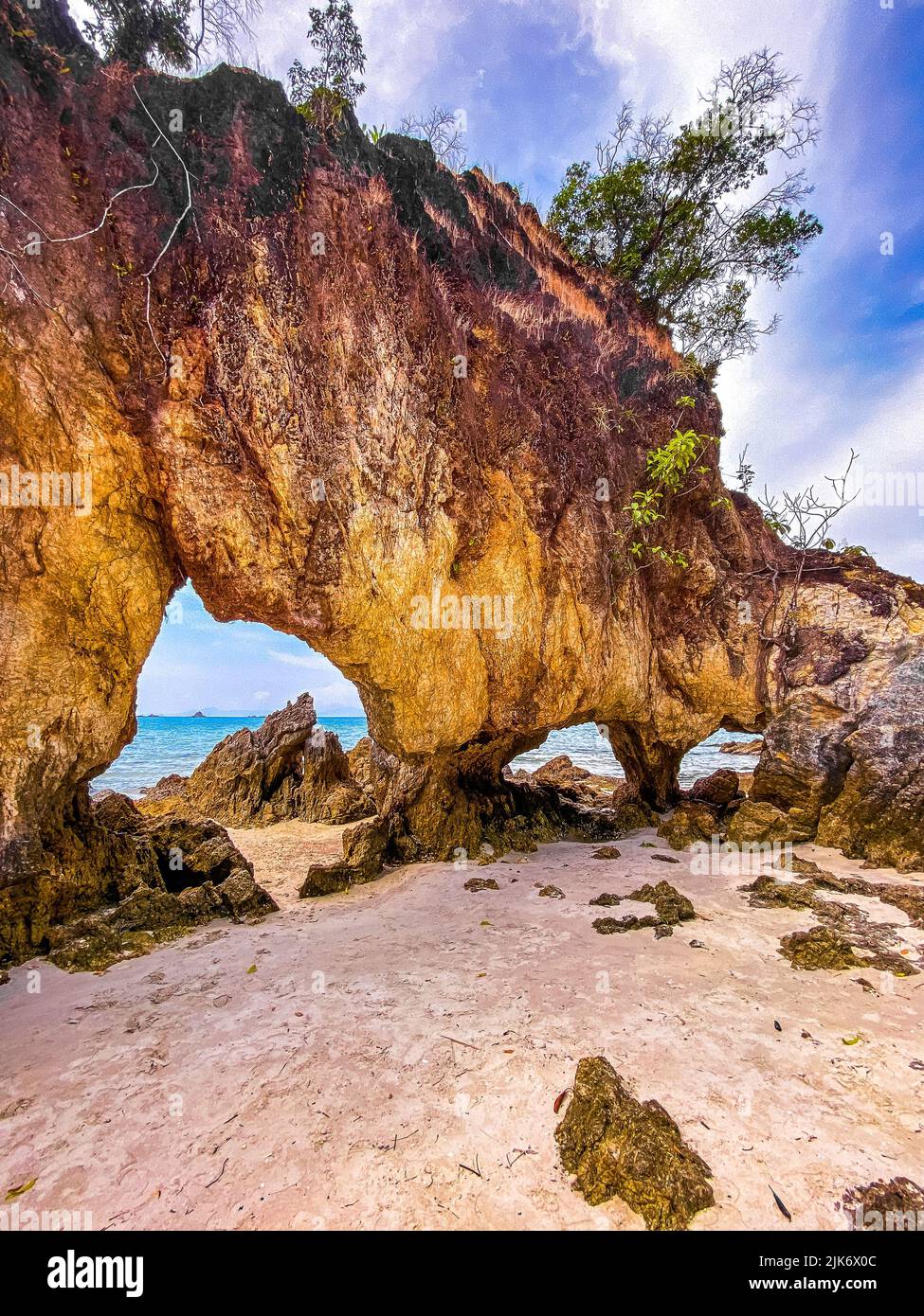 Koh Phayam beach Hin Talu with rock arch formation in Ranong, Thailand ...