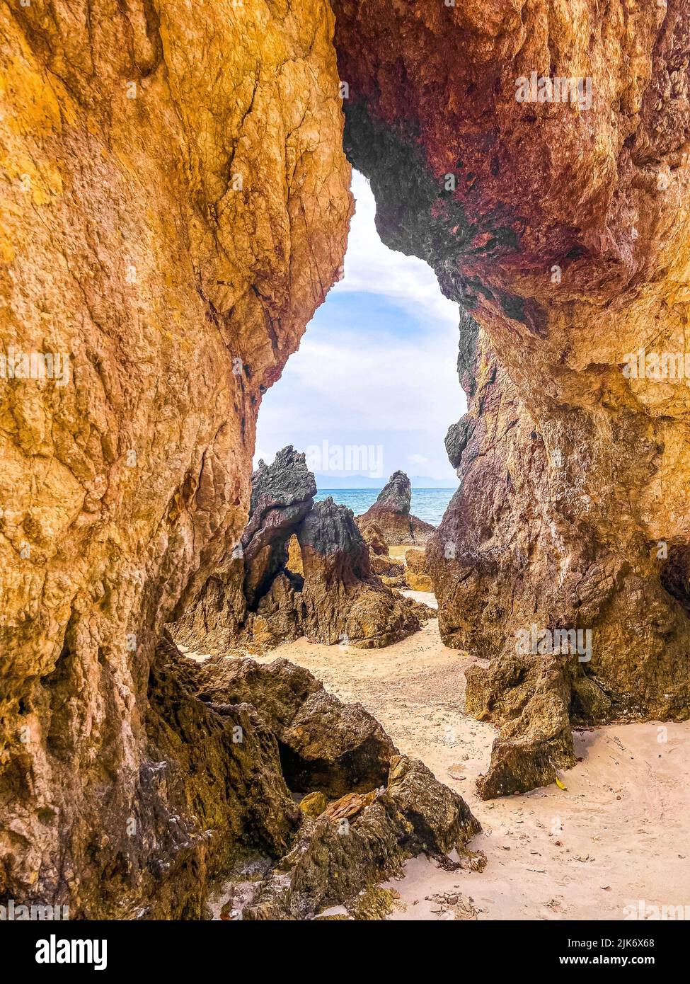 Koh Phayam beach Hin Talu with rock arch formation in Ranong, Thailand ...