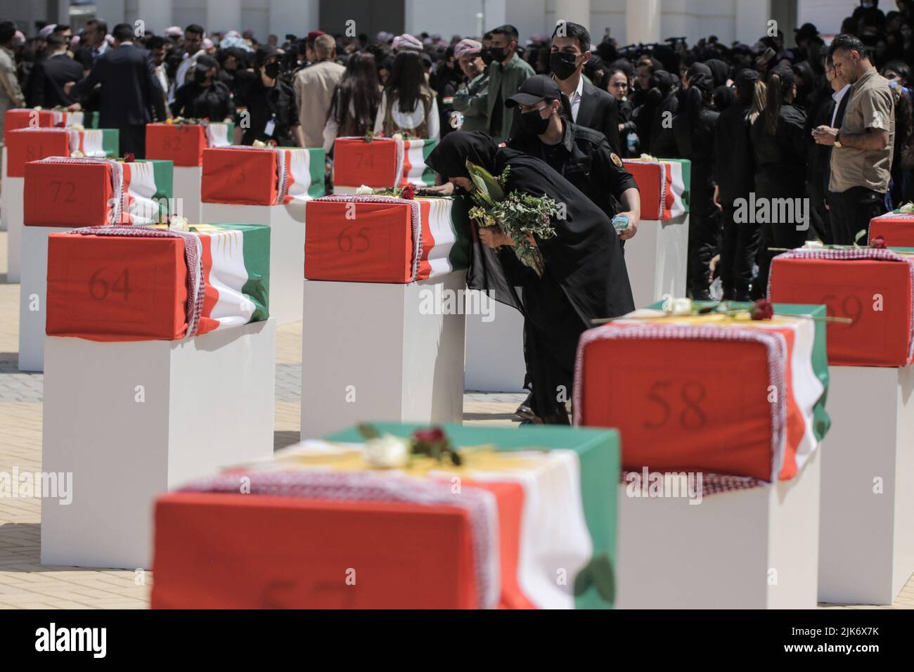 Barzan, Iraq. 31st July, 2022. A Kurdish woman mourns over one of the ...