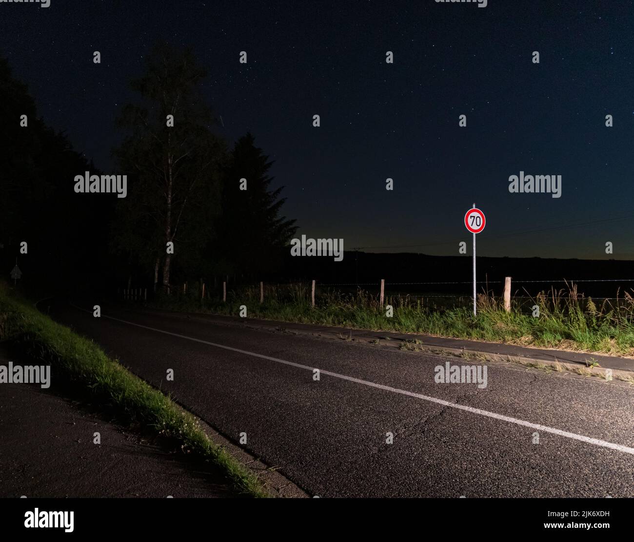 Dark night road sign in hi-res stock photography and images - Alamy