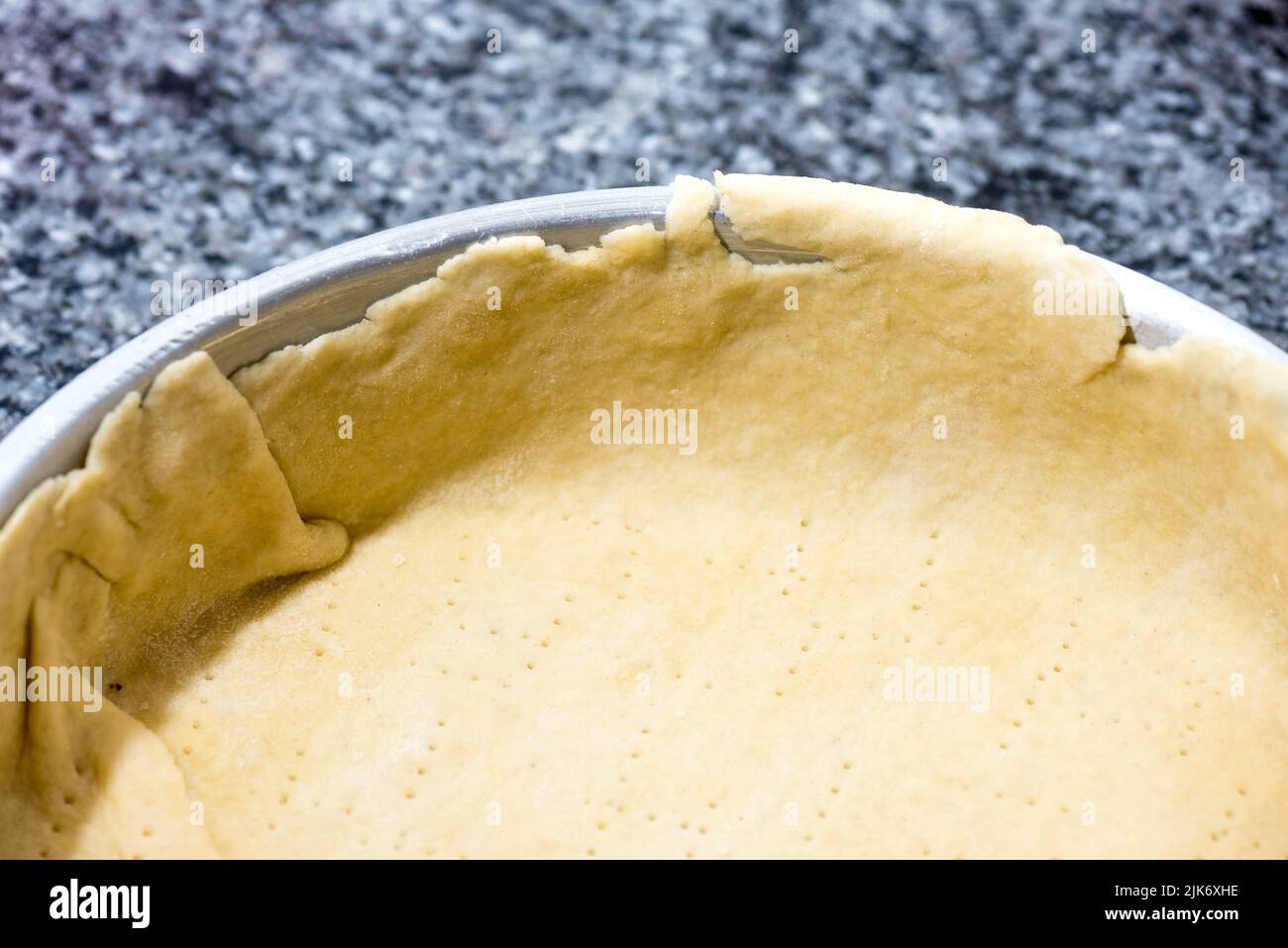 Details on a pre-baked pastry before it get filled with onion sauce to ...