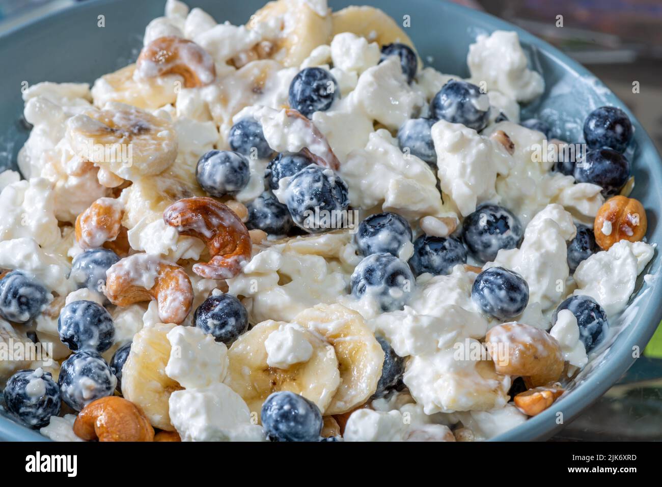 Beautiful breakfast - cottage cheese, berries cashew, cedar, blueberry ...