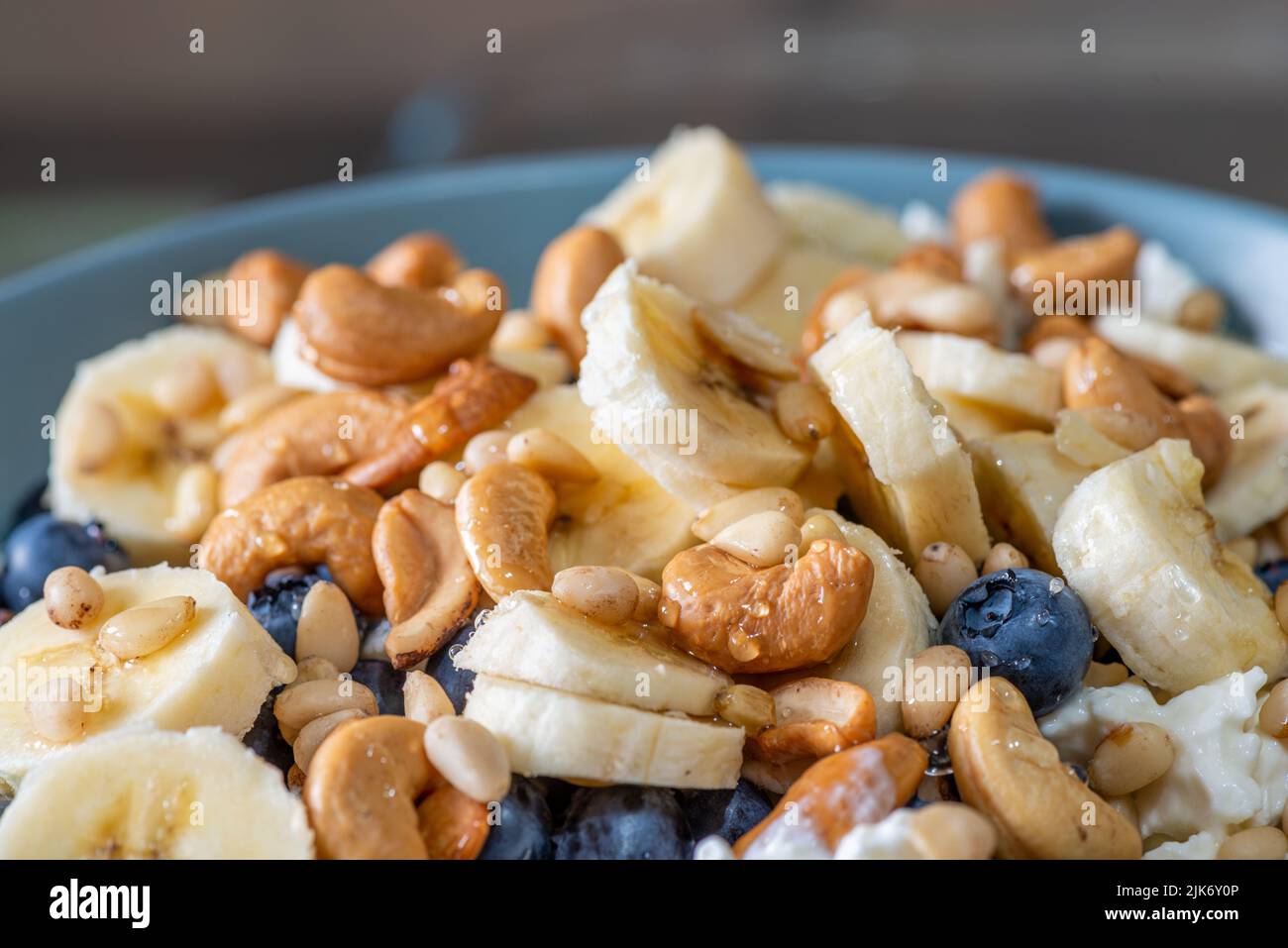 Beautiful breakfast - cottage cheese, berries cashew, cedar, blueberry ...
