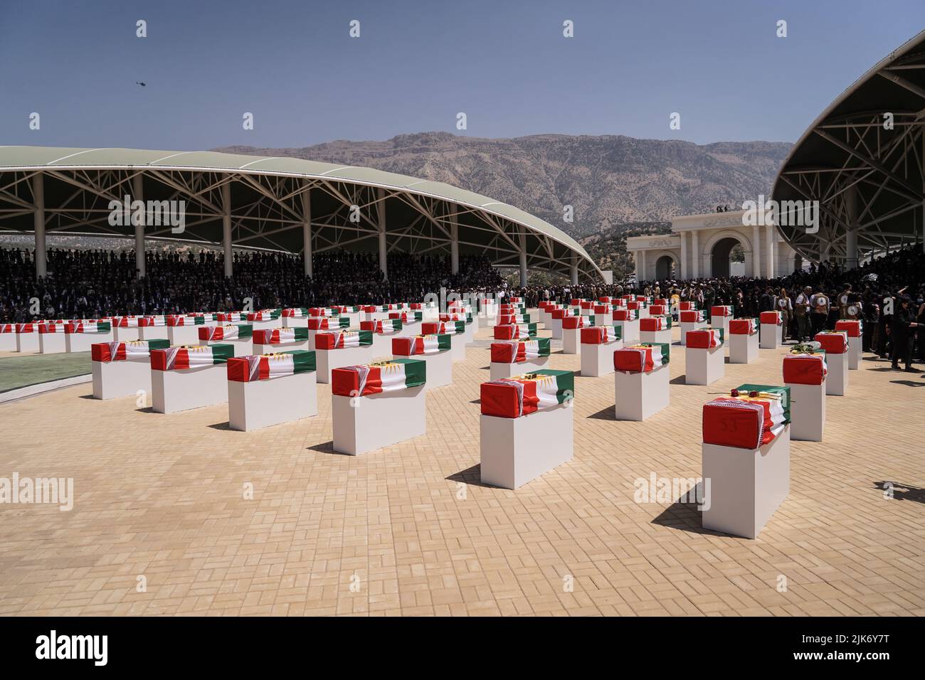 Barzan, Iraq. 31st July, 2022. Coffins containing the remains of 100 ...