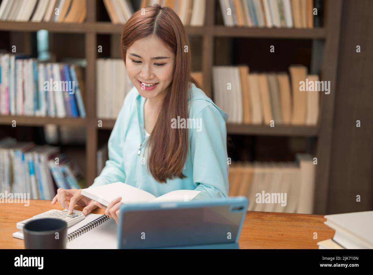 Education concept, Teenage girl watching video math tutorial and use ...