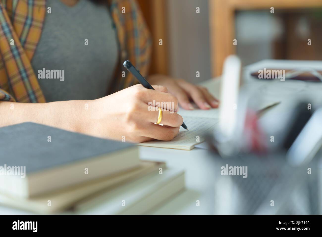 Education and literacy concept, College student girl read lesson sheet ...