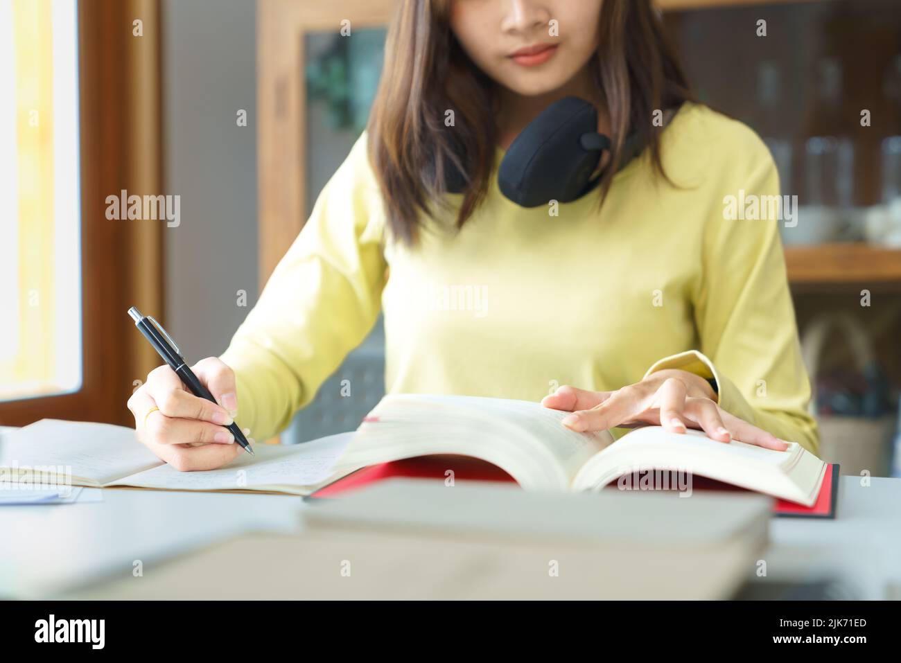 Education and literacy concept, College student girl reading textbook ...