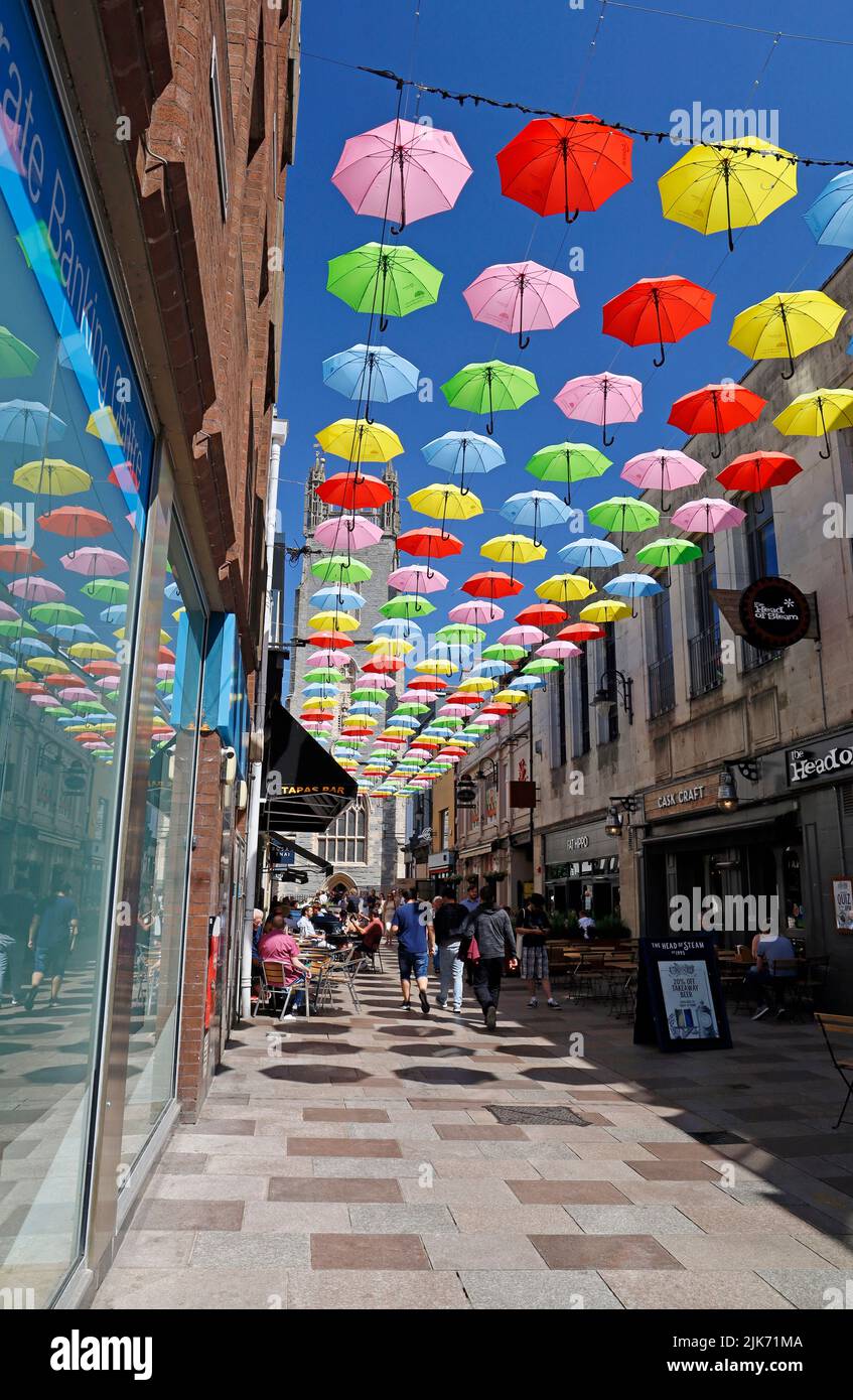 Colourful suspended overhead umbrella display with blue sky. Cardiff ...