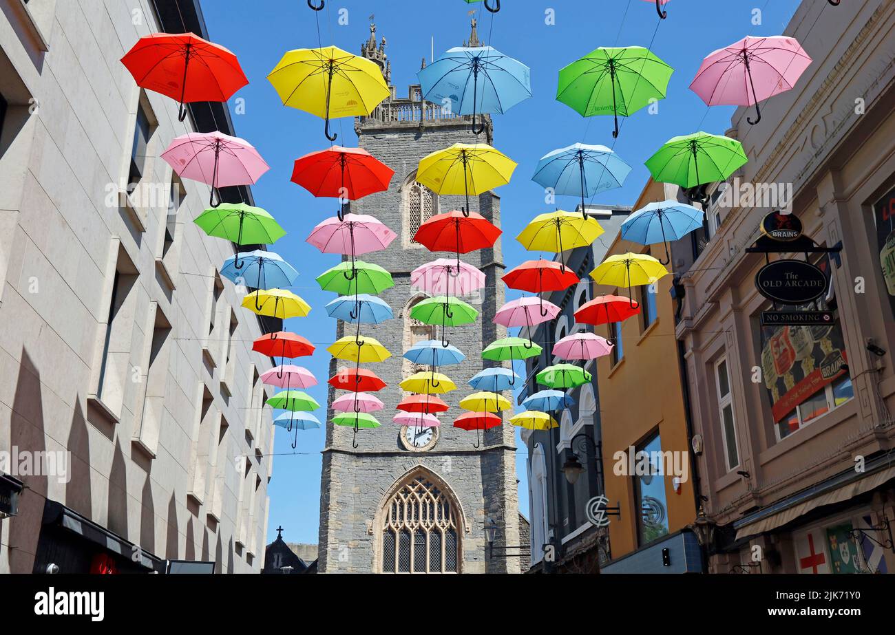 Colourful suspended overhead umbrella display with blue sky. Cardiff ...