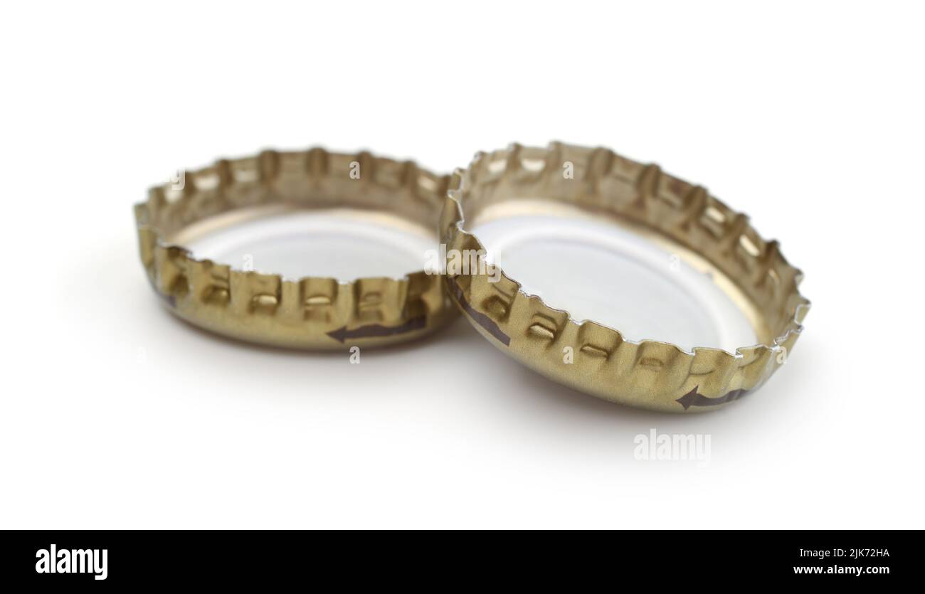 Metal caps for beer bottles isolated on white Stock Photo - Alamy
