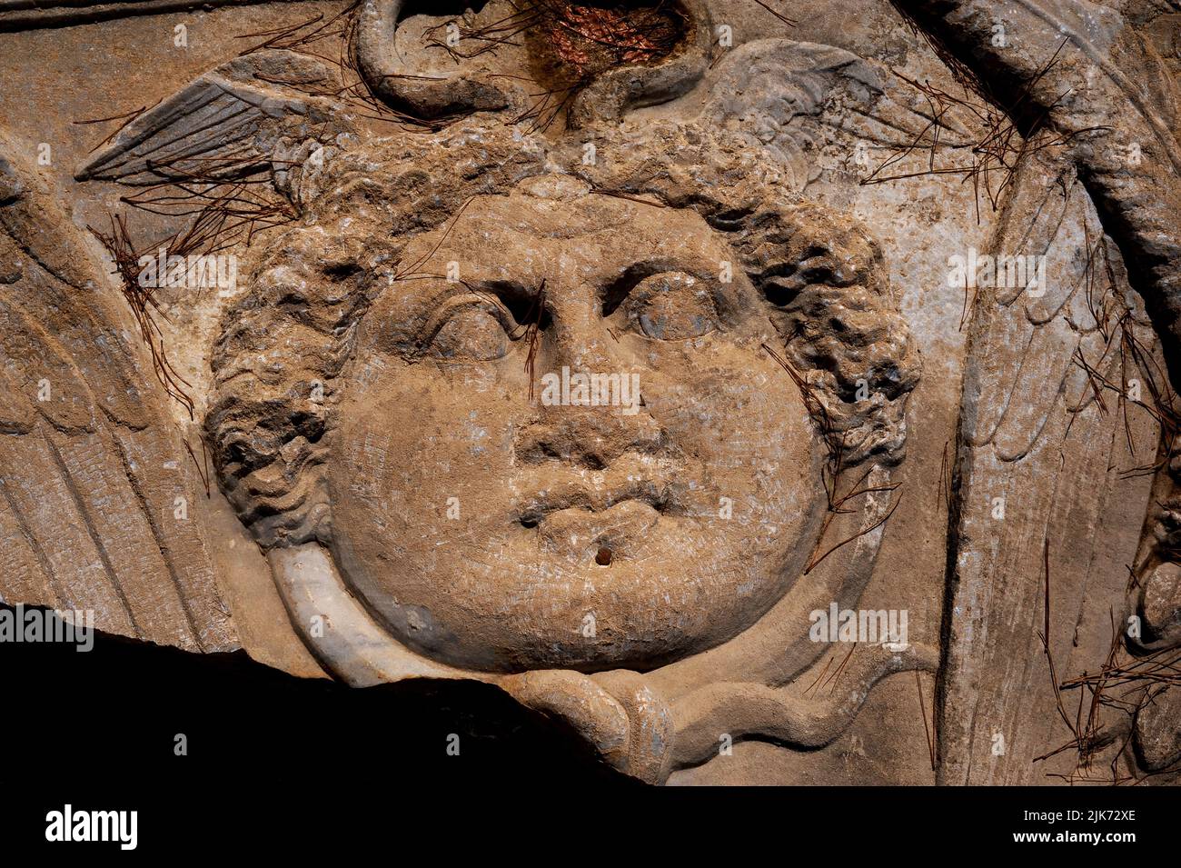 Winged Gorgon or Medusa face on a plundered Roman stone sarcophagus in ...