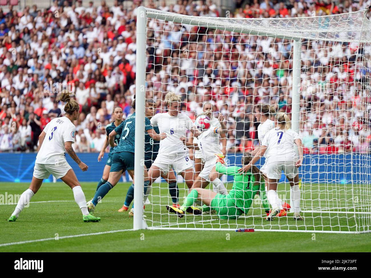 The ball rebounds off England players during a goalmouth scramble ...
