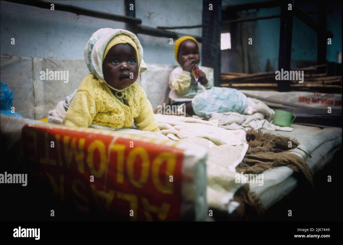 Babies at a Tobacco factory whilst their mother is working on the ...