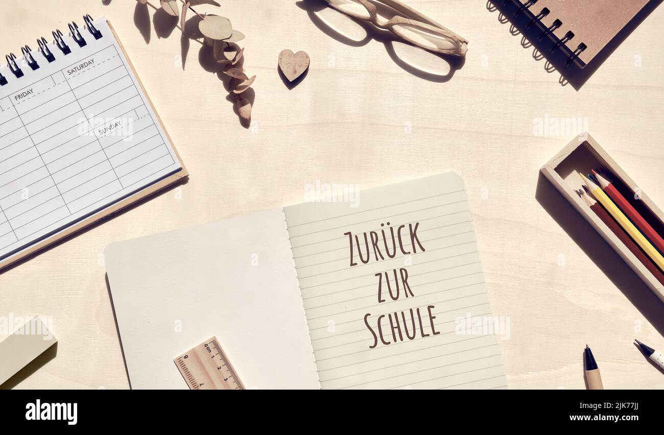 Zuruch zur schule text means back to school in German language. Wooden ...