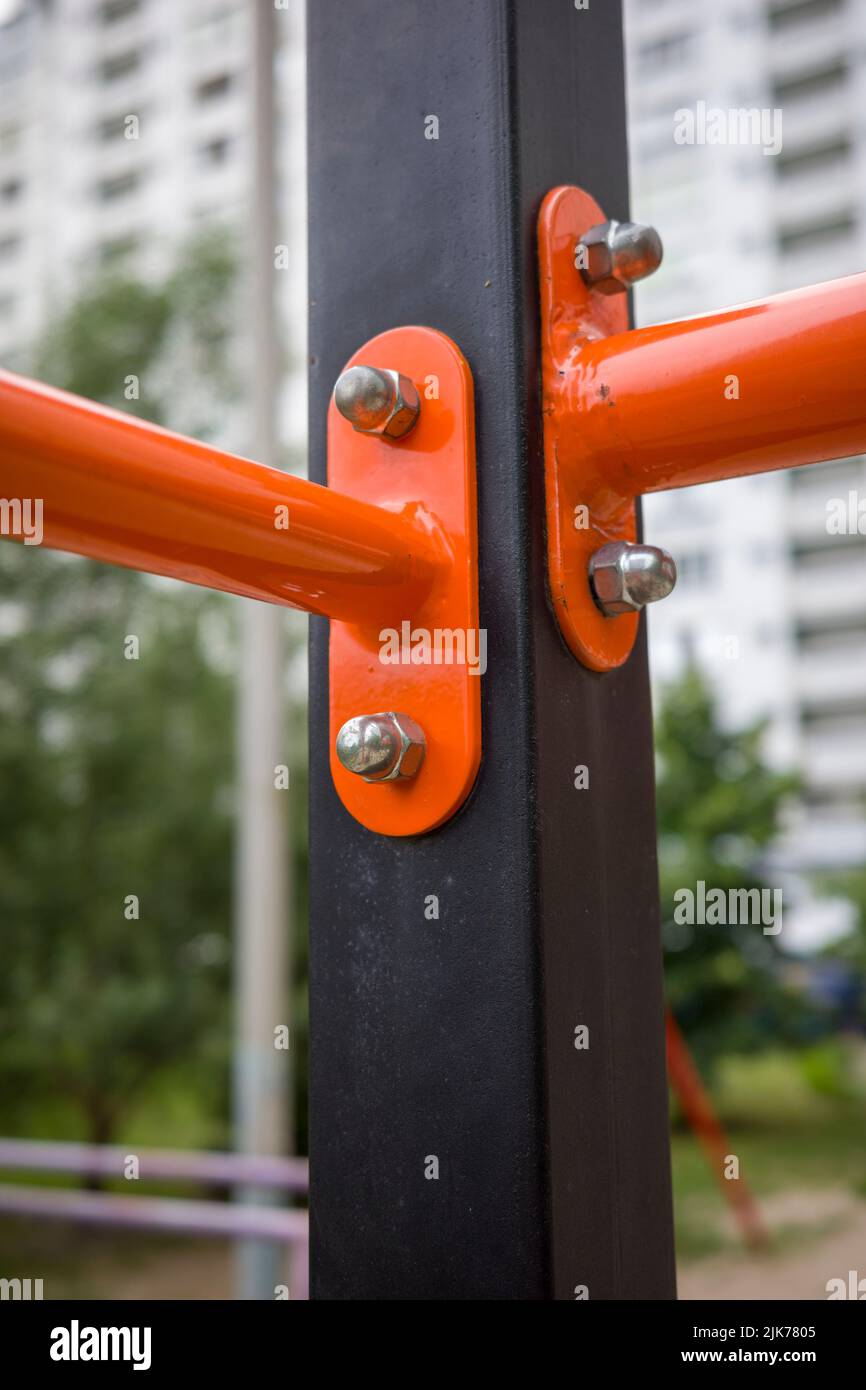 fastening of the sports horizontal bar to the playground, metal screws ...